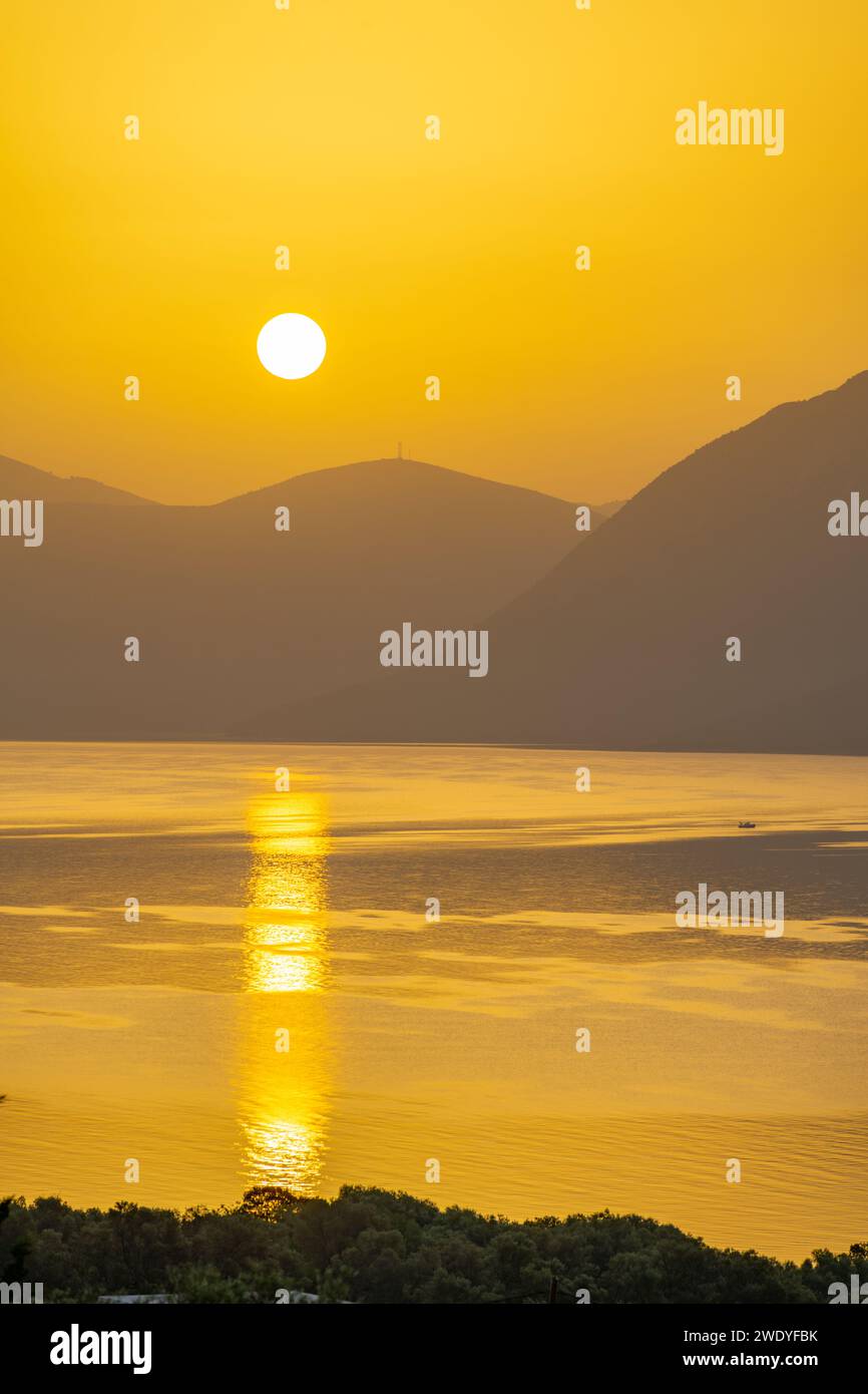 Dawn breaking behind the mountains of Mainland Greece from the Island ...