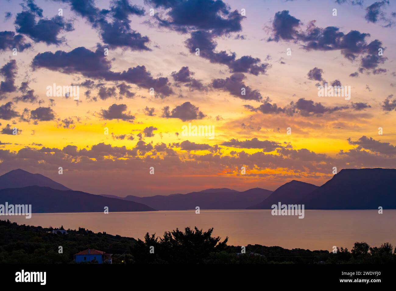 Dawn breaking behind the mountains of Mainland Greece from the Island ...