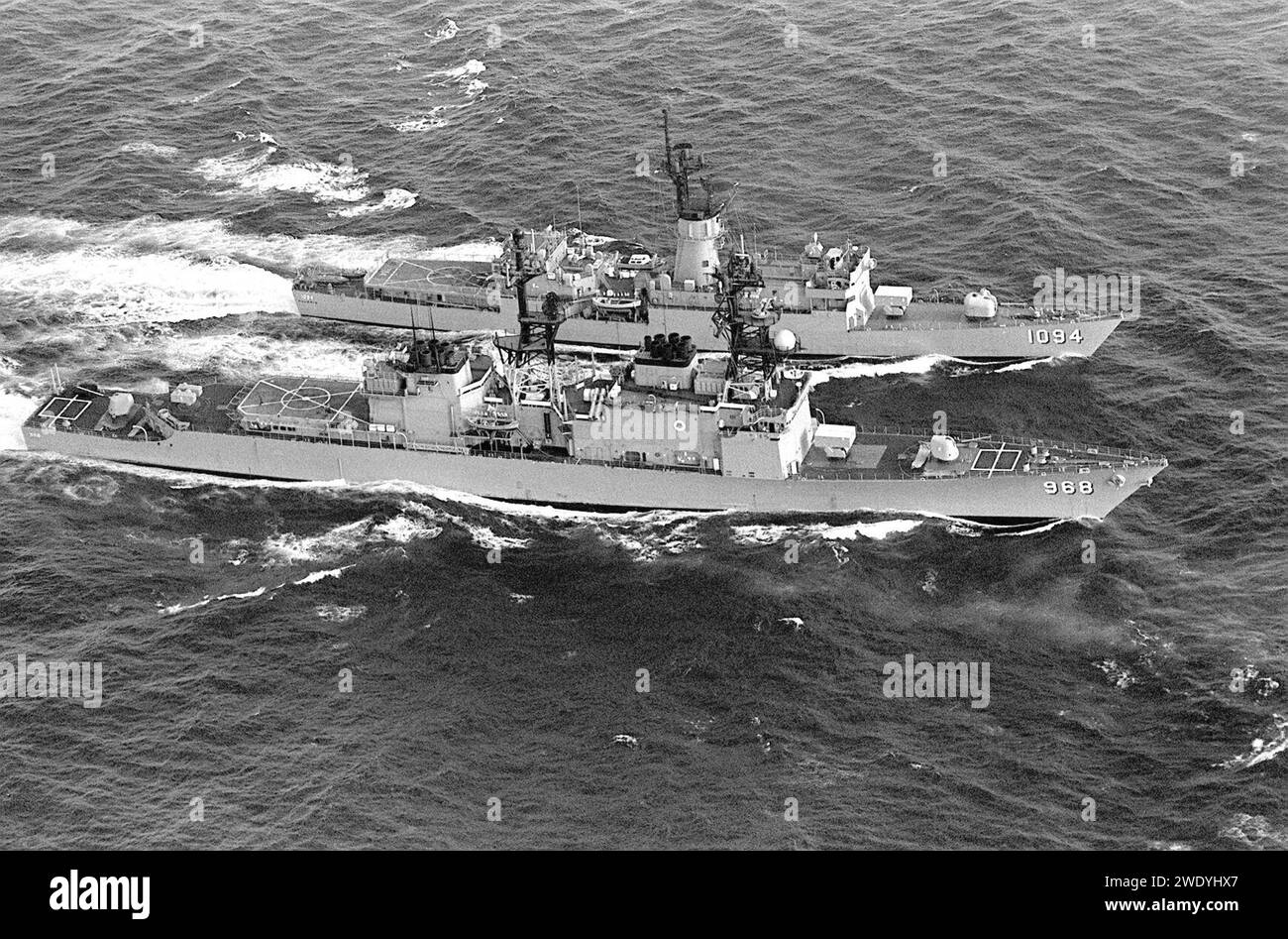 Aerial starboard beam view of USS Pharris (FF-1094) and USS Arthur W ...