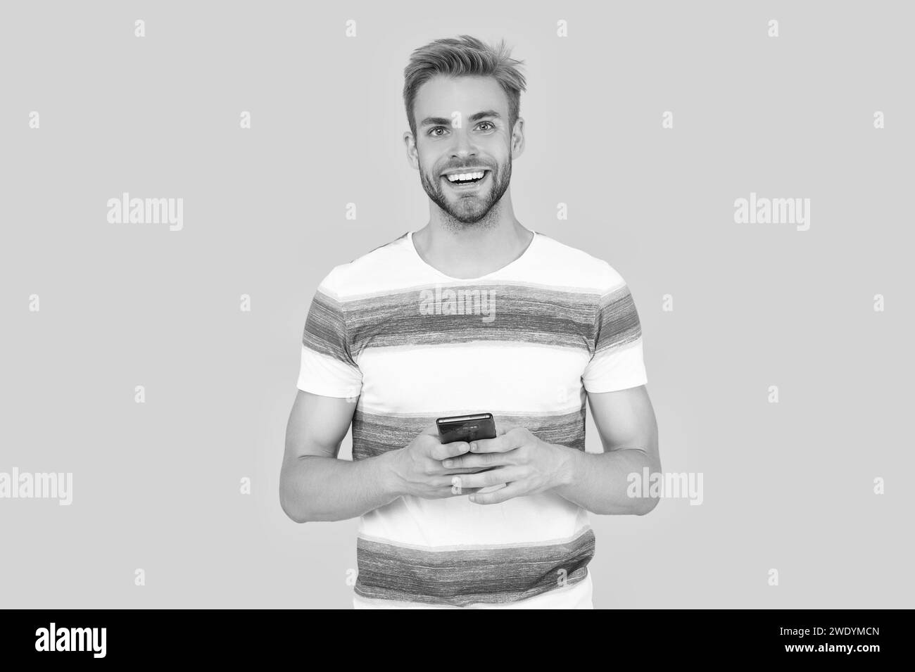 man smile uses phone to make effective communication. man has phone ...