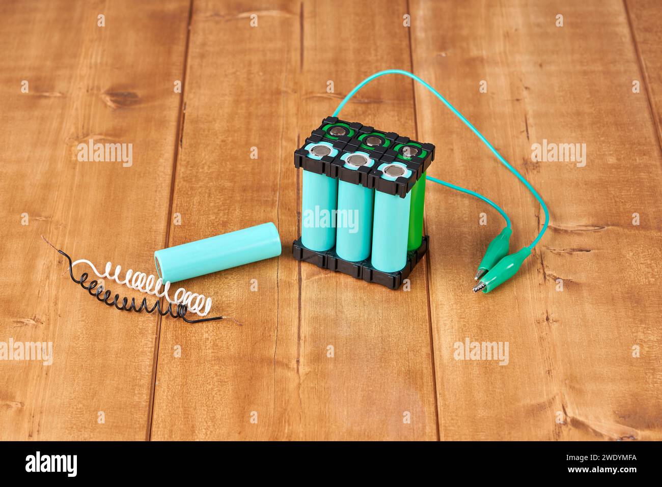 Lithium battery pack in black plastic holder wooden table Stock Photo ...