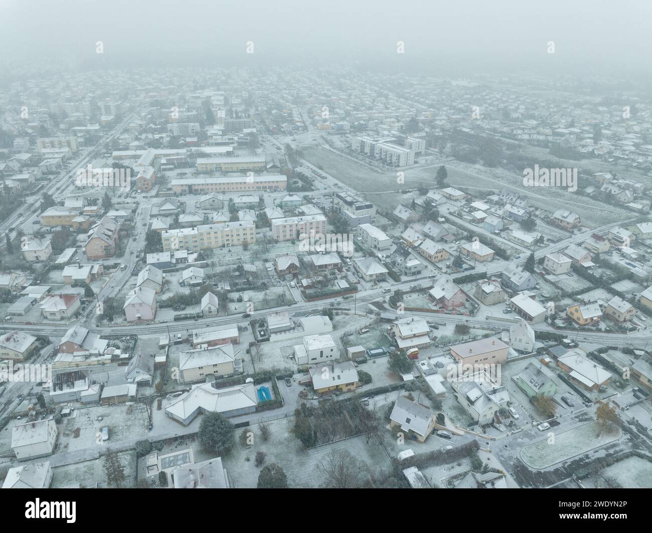 Aerial view of falling snow in the residential area Kingersheim ...