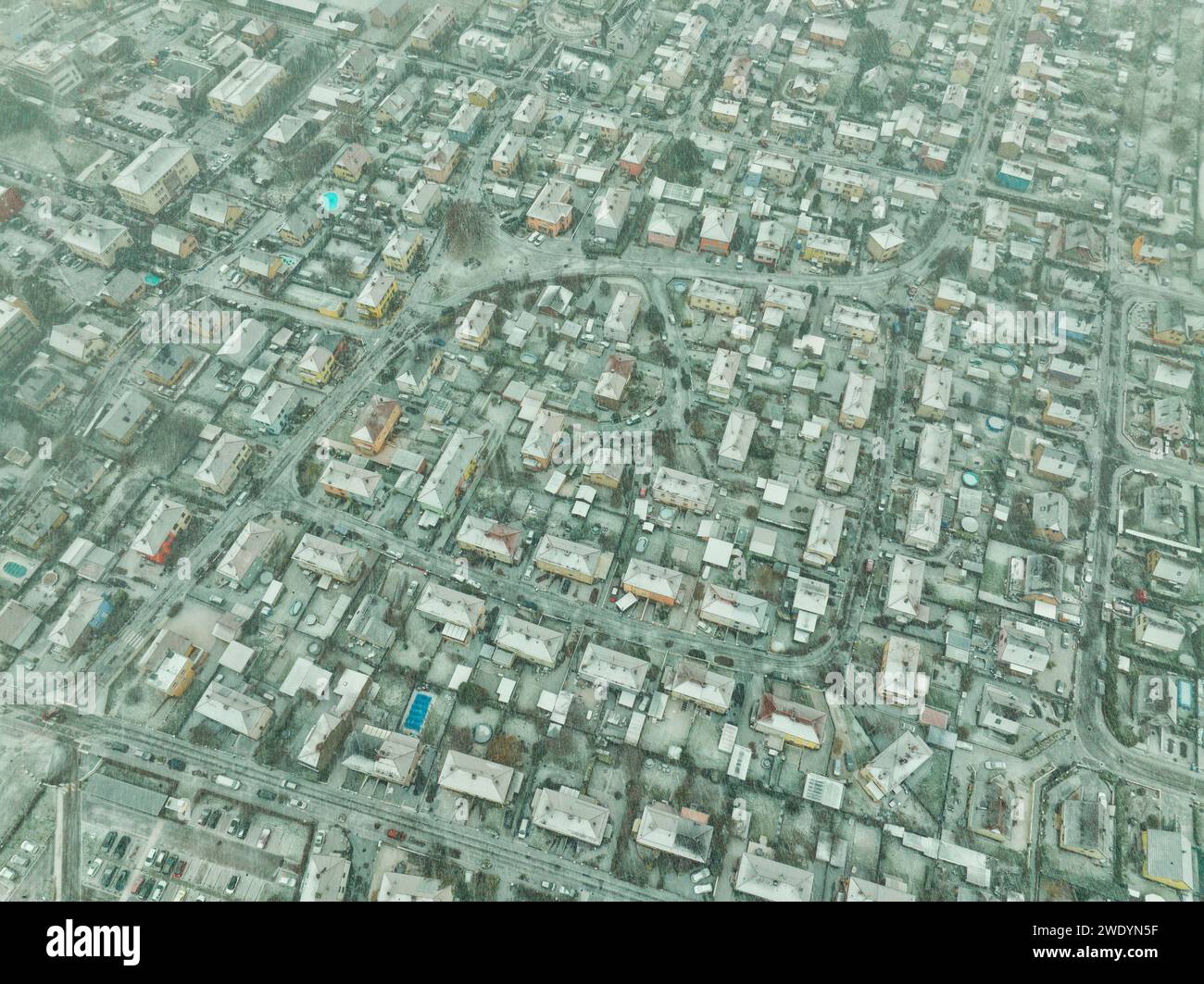 Aerial view of falling snow in the residential area Kingersheim ...