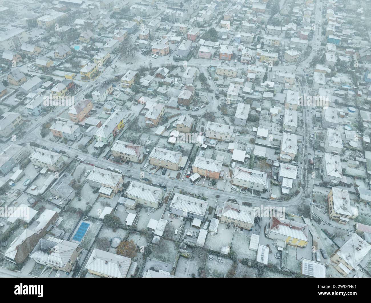 Aerial view of falling snow in the residential area Kingersheim ...