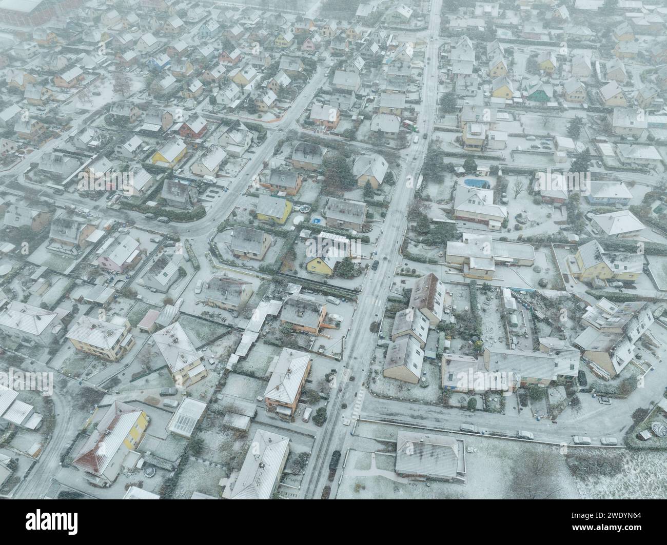 Aerial view of falling snow in the residential area Kingersheim ...