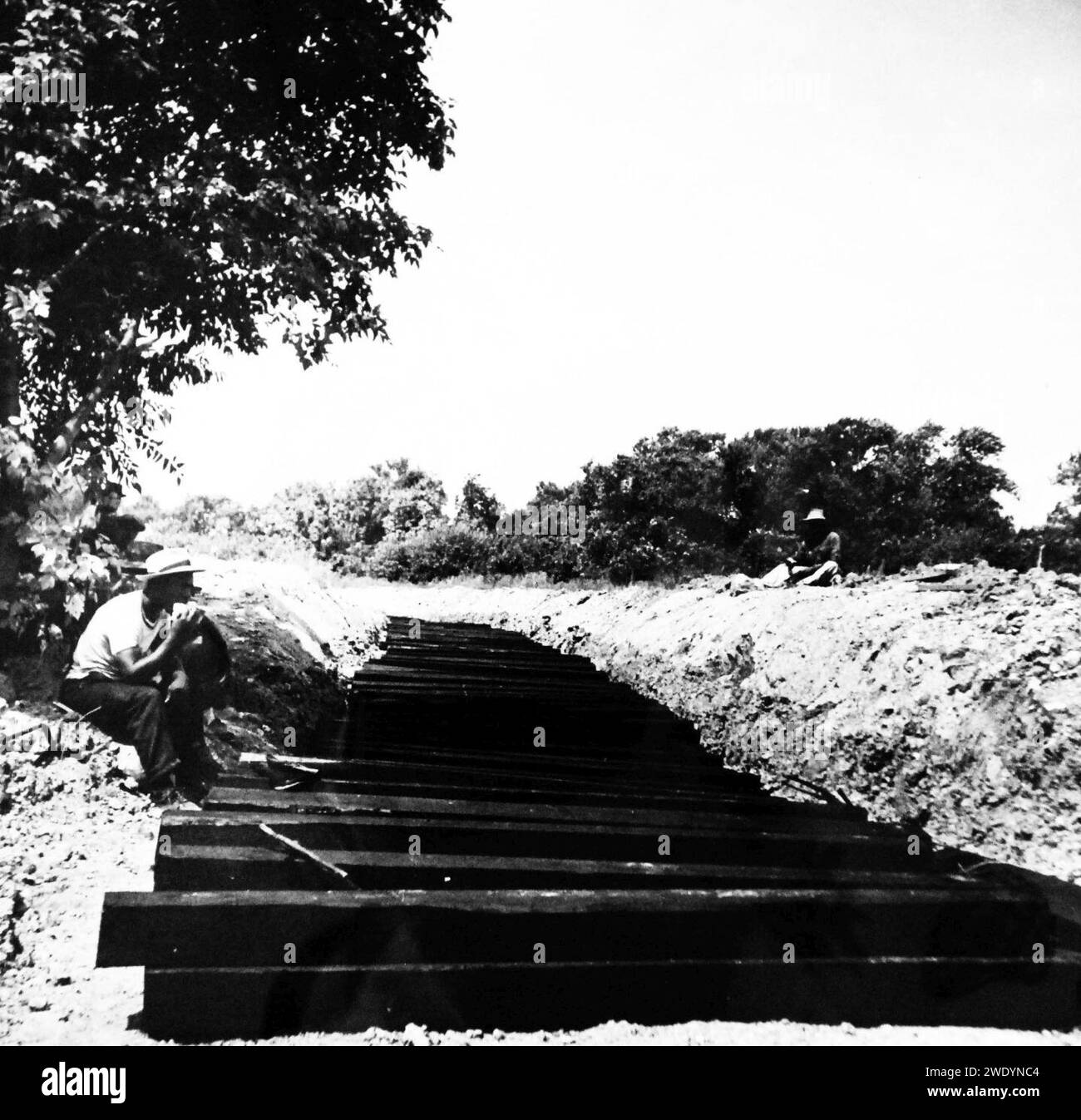 African-American workers laying railroad ties for spur line, 1942 ...