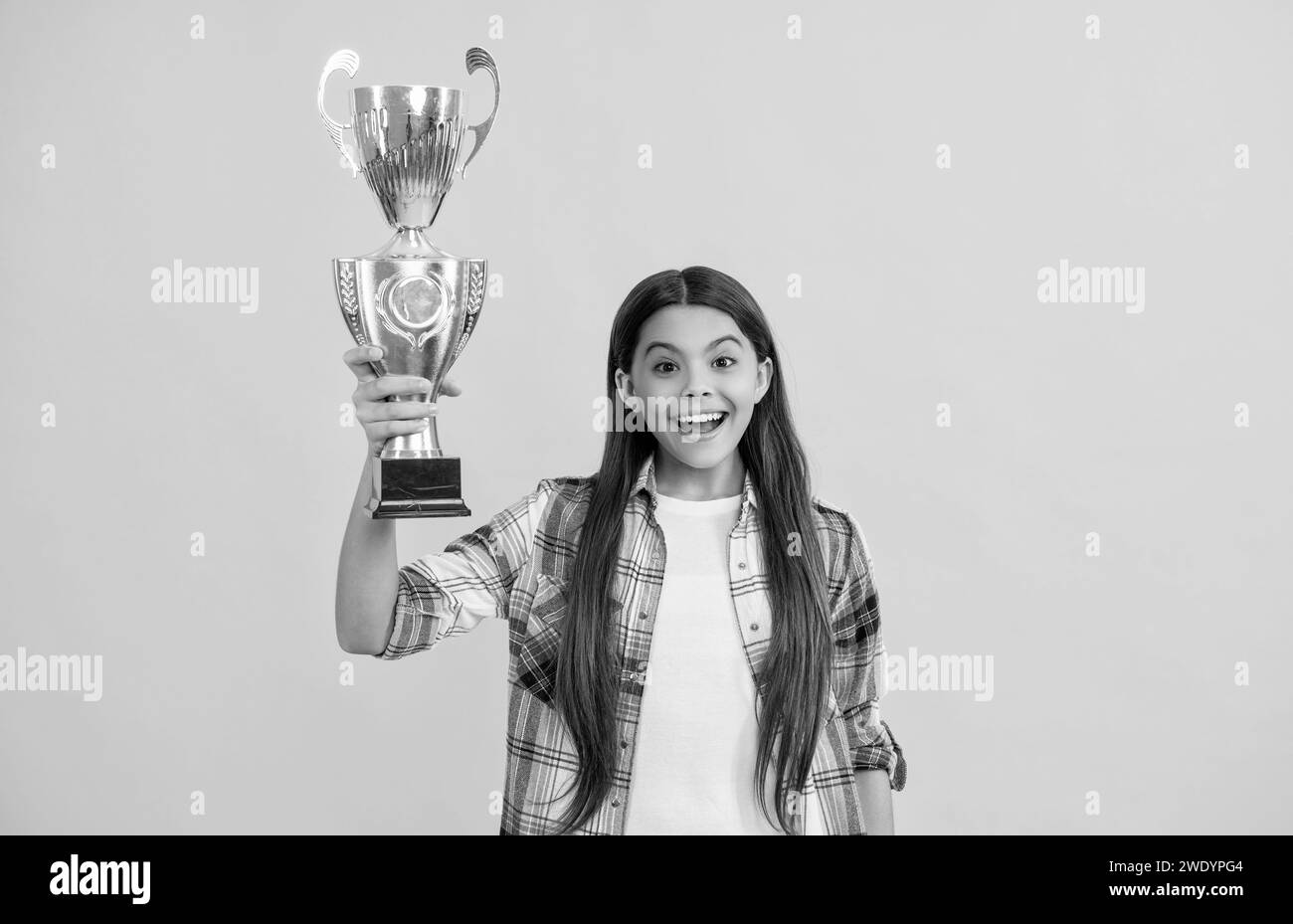 amazed teen girl receive award in studio. teen girl accept award on ...