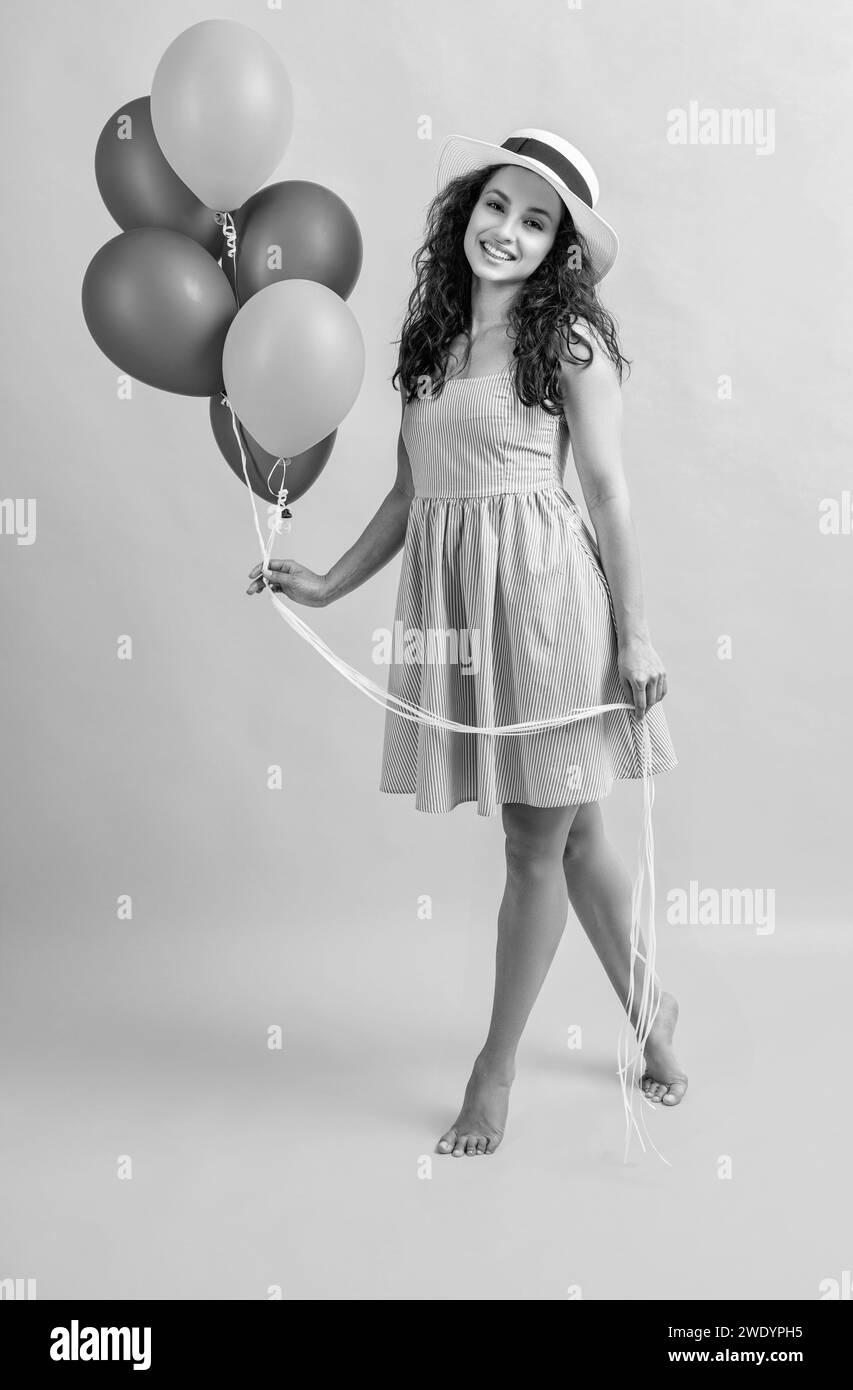 cheerful summer woman with balloons isolated on yellow. summer woman ...