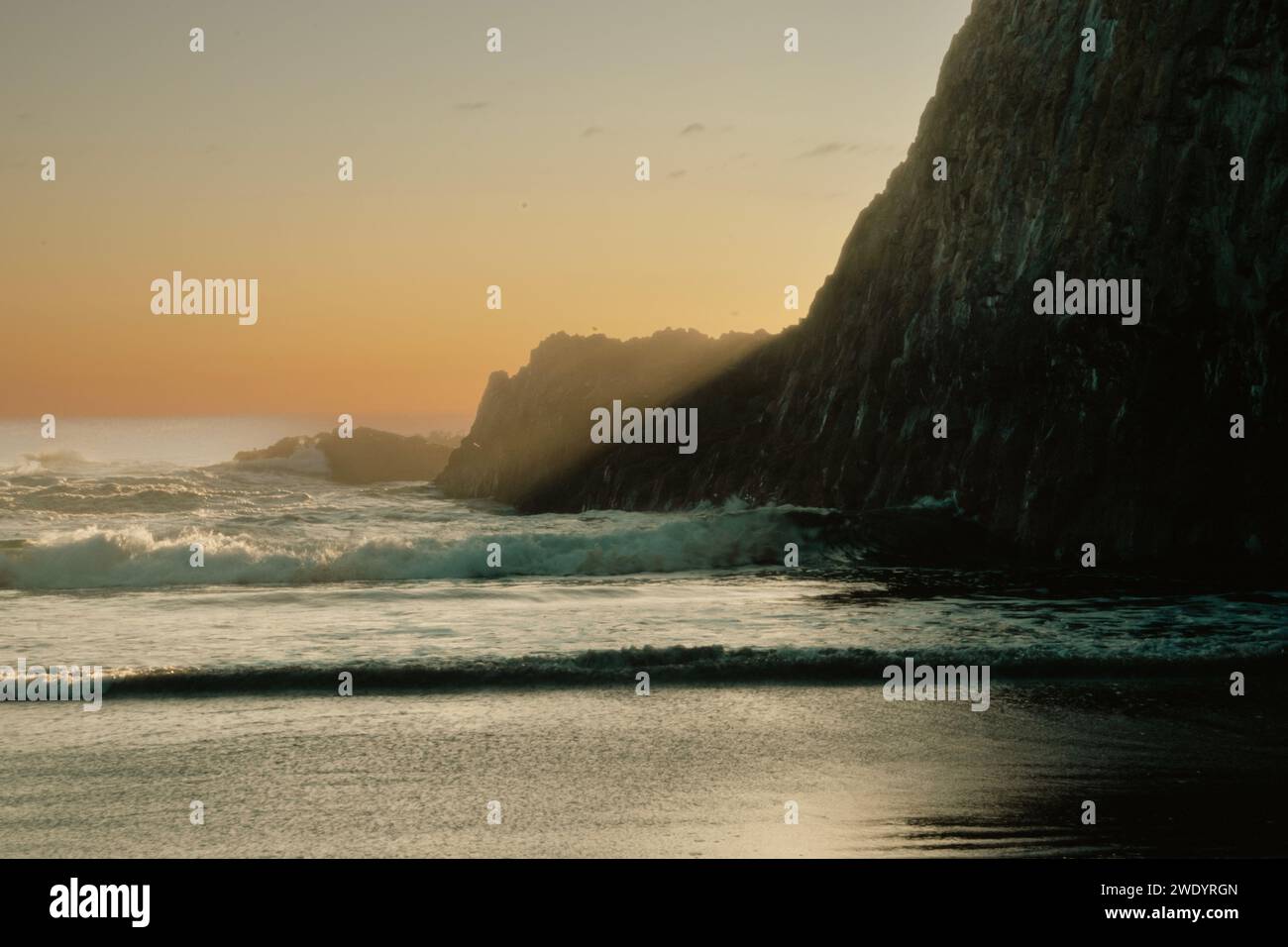 Sunset over the Pacific Ocean at South Seal Point, waves washing over ...