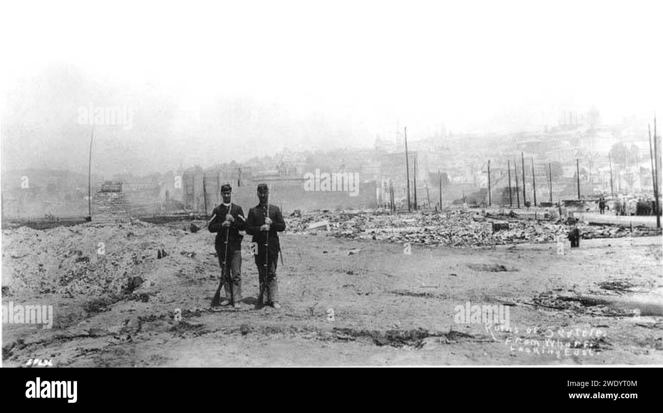 Aftermath of the Seattle fire of June 6, showing two members of the ...