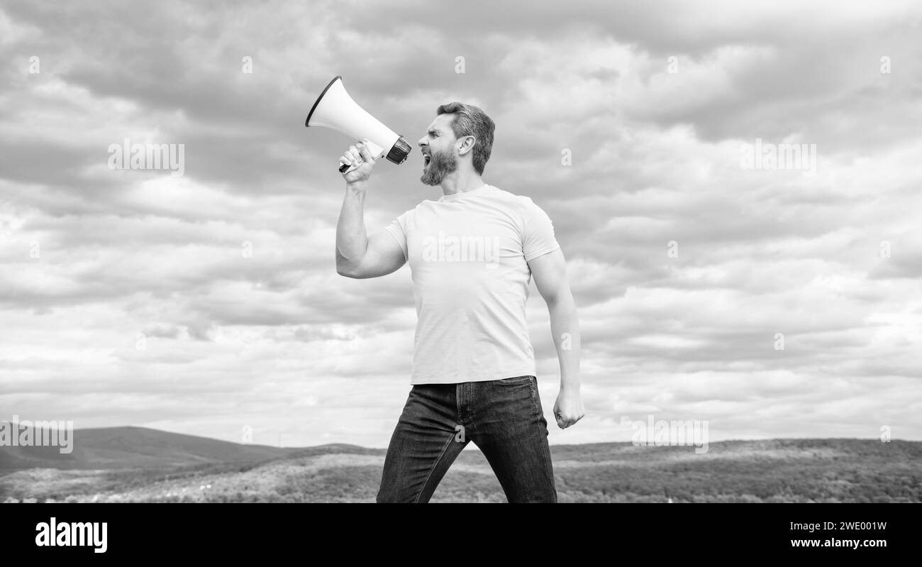 Man speaking in megaphone Black and White Stock Photos & Images - Alamy