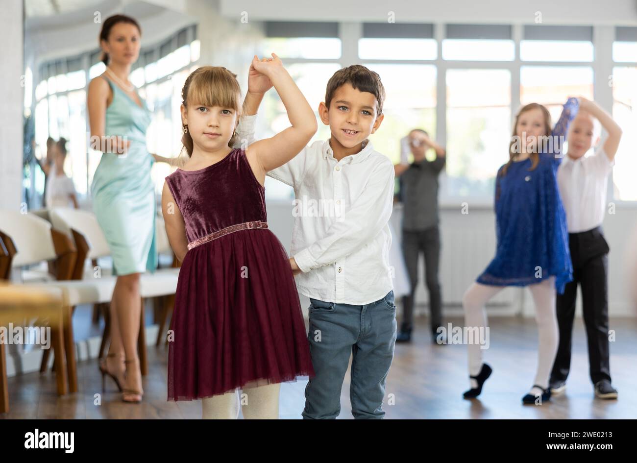Classical dances performed by preteen children in festive clothes Stock ...