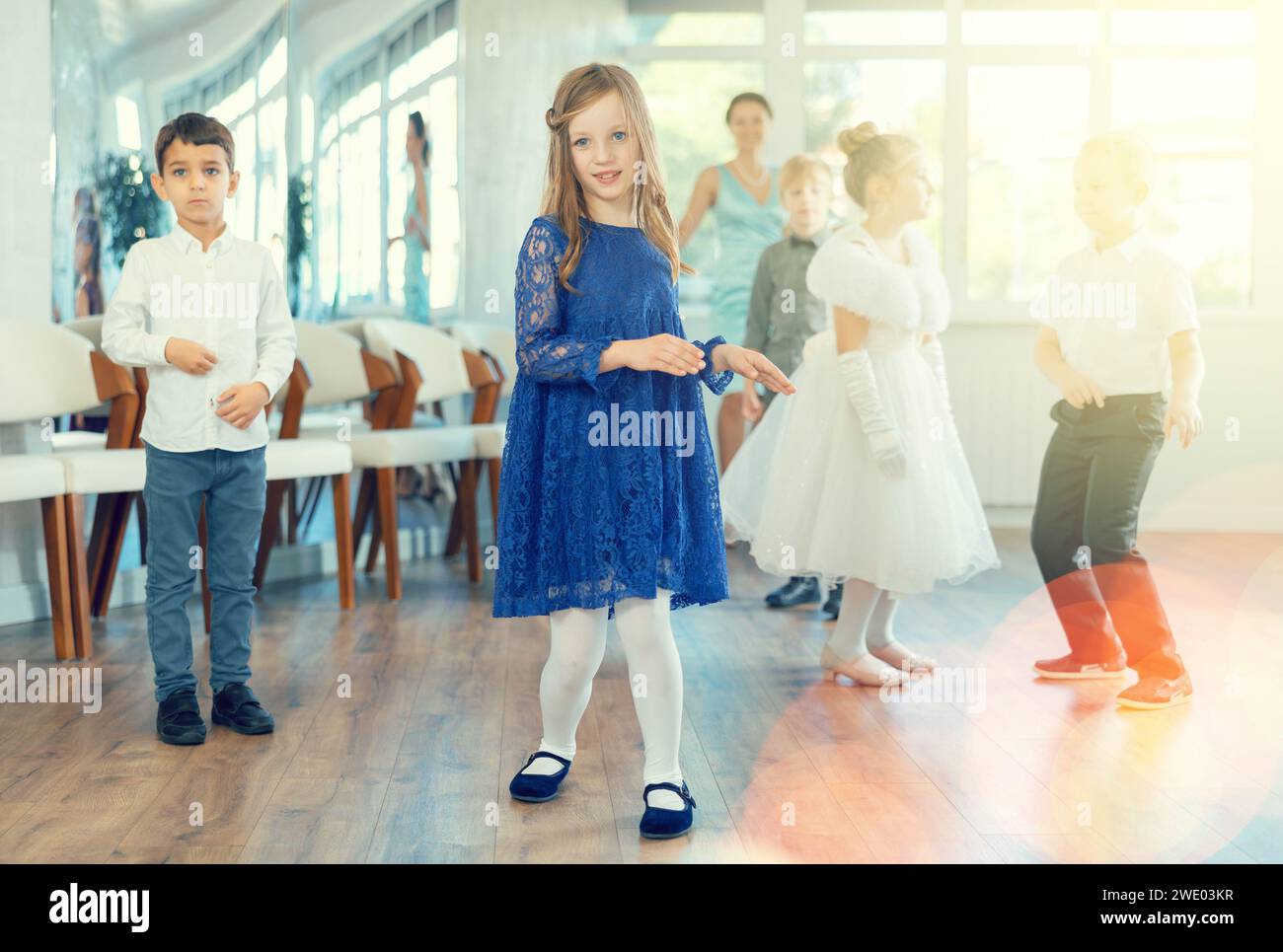 Preteen girl dancing twist with classmates during school party Stock ...