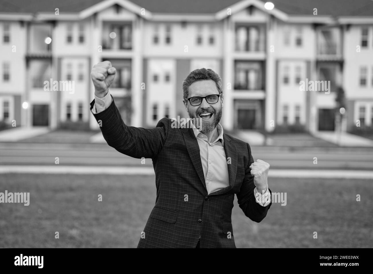 glad salesman at the house. salesman in the suit. salesman outdoor ...