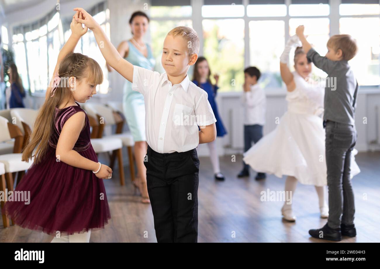 Children dancing together ballroom hi-res stock photography and images ...