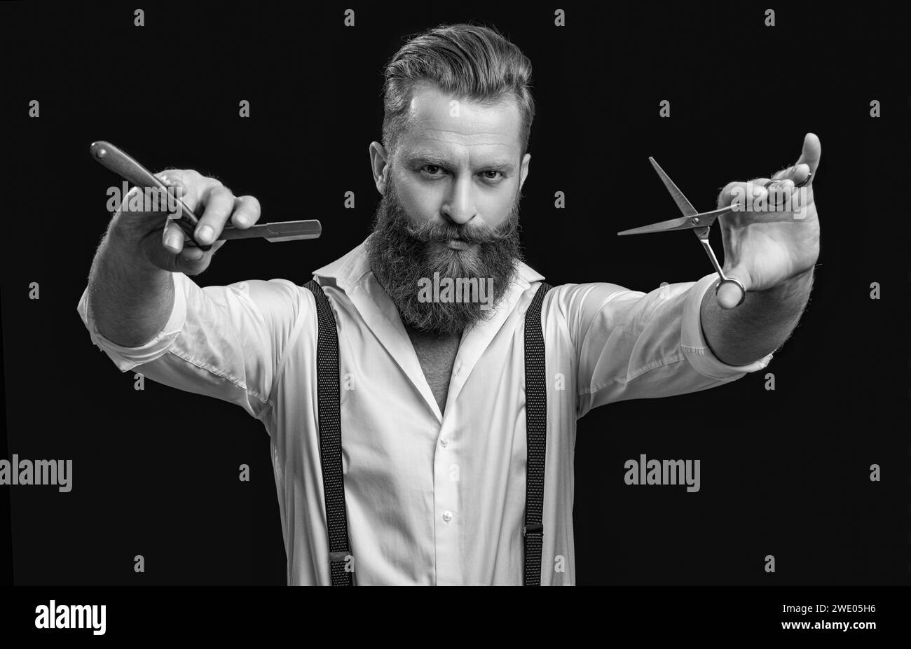 brutal barbershop man in studio. barbershop man with scissors and retro ...