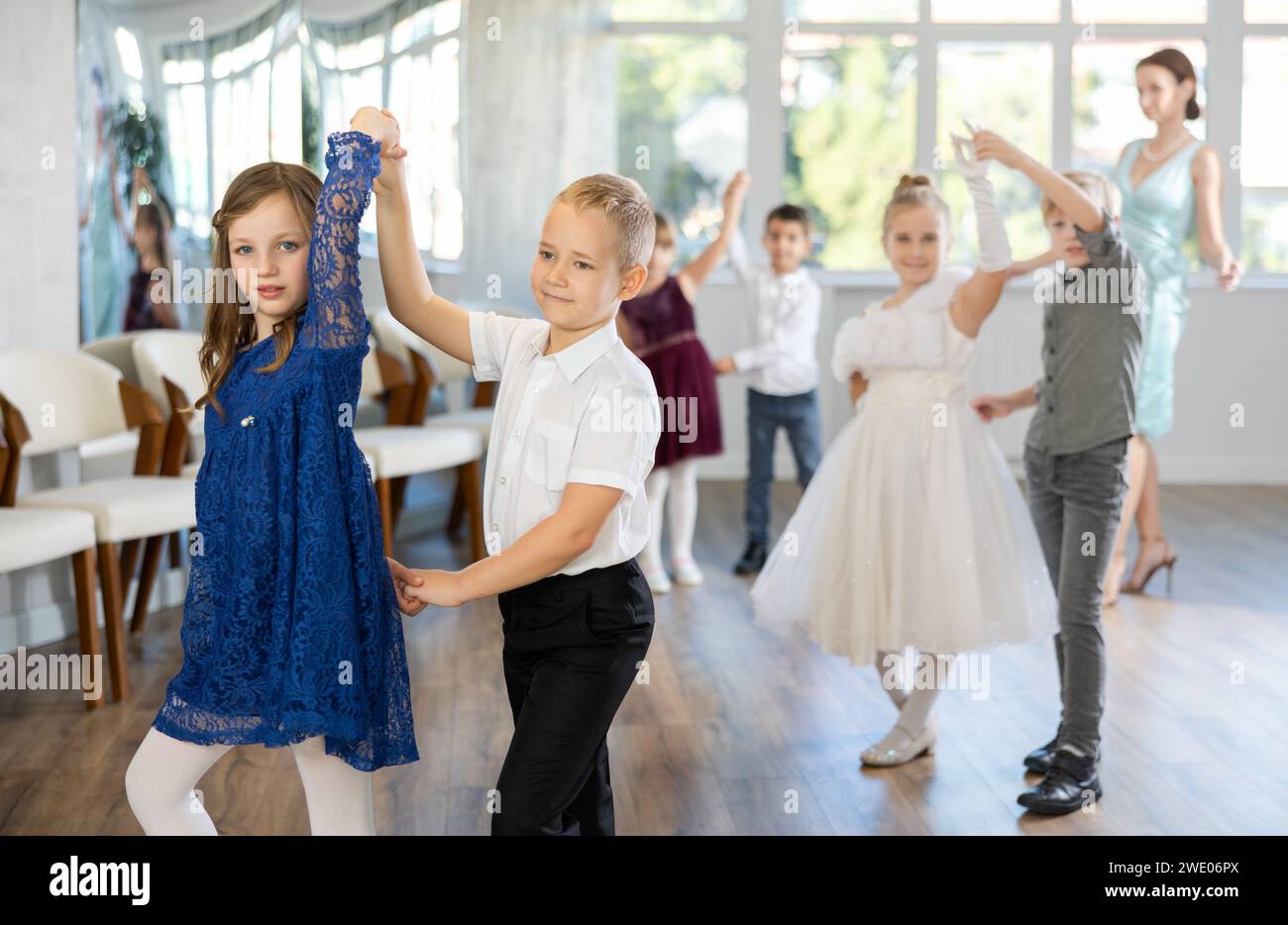 Classical dances performed by preteen children in festive clothes Stock ...