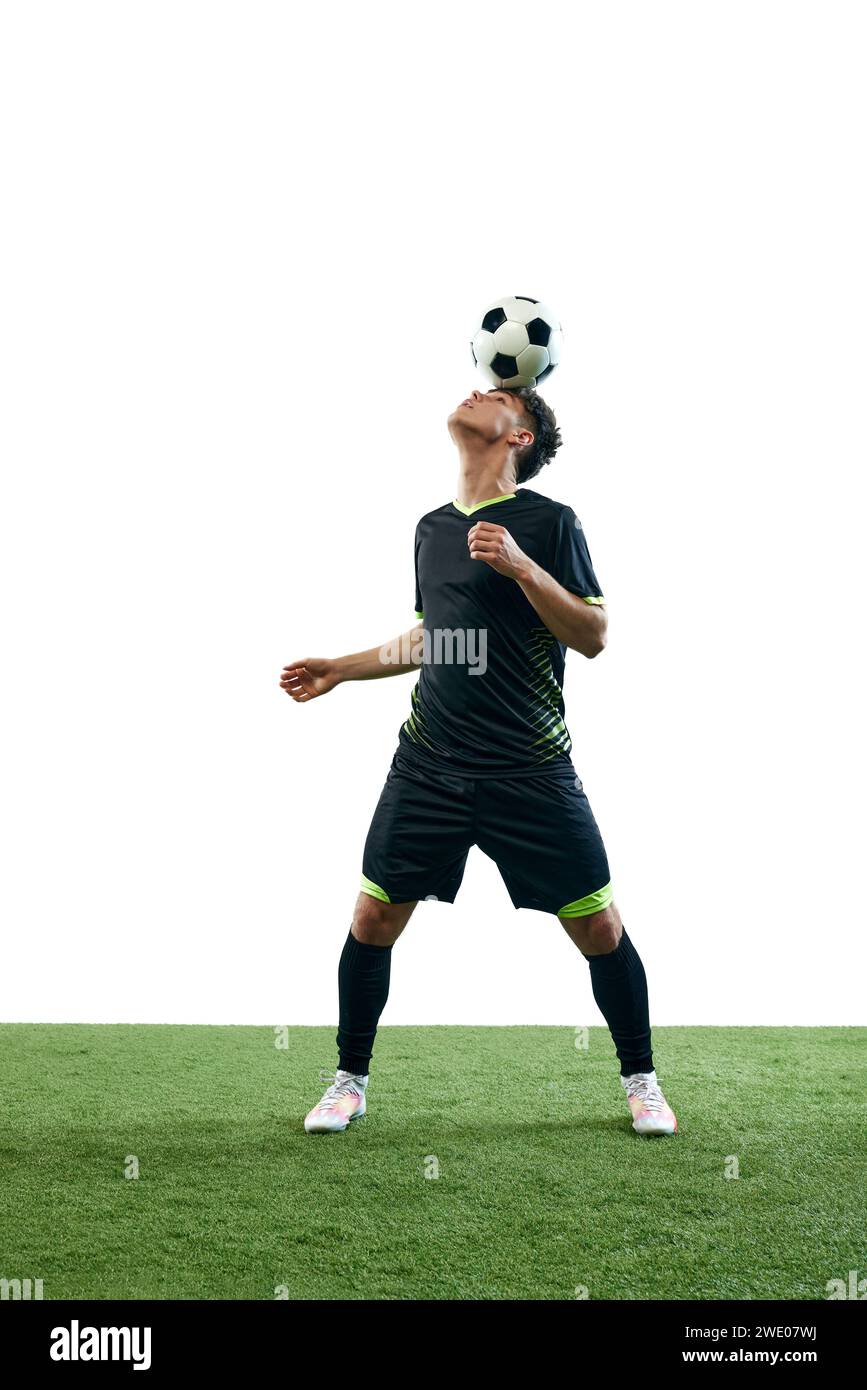 Full-length of young guy, soccer player during game, balancing ball on ...