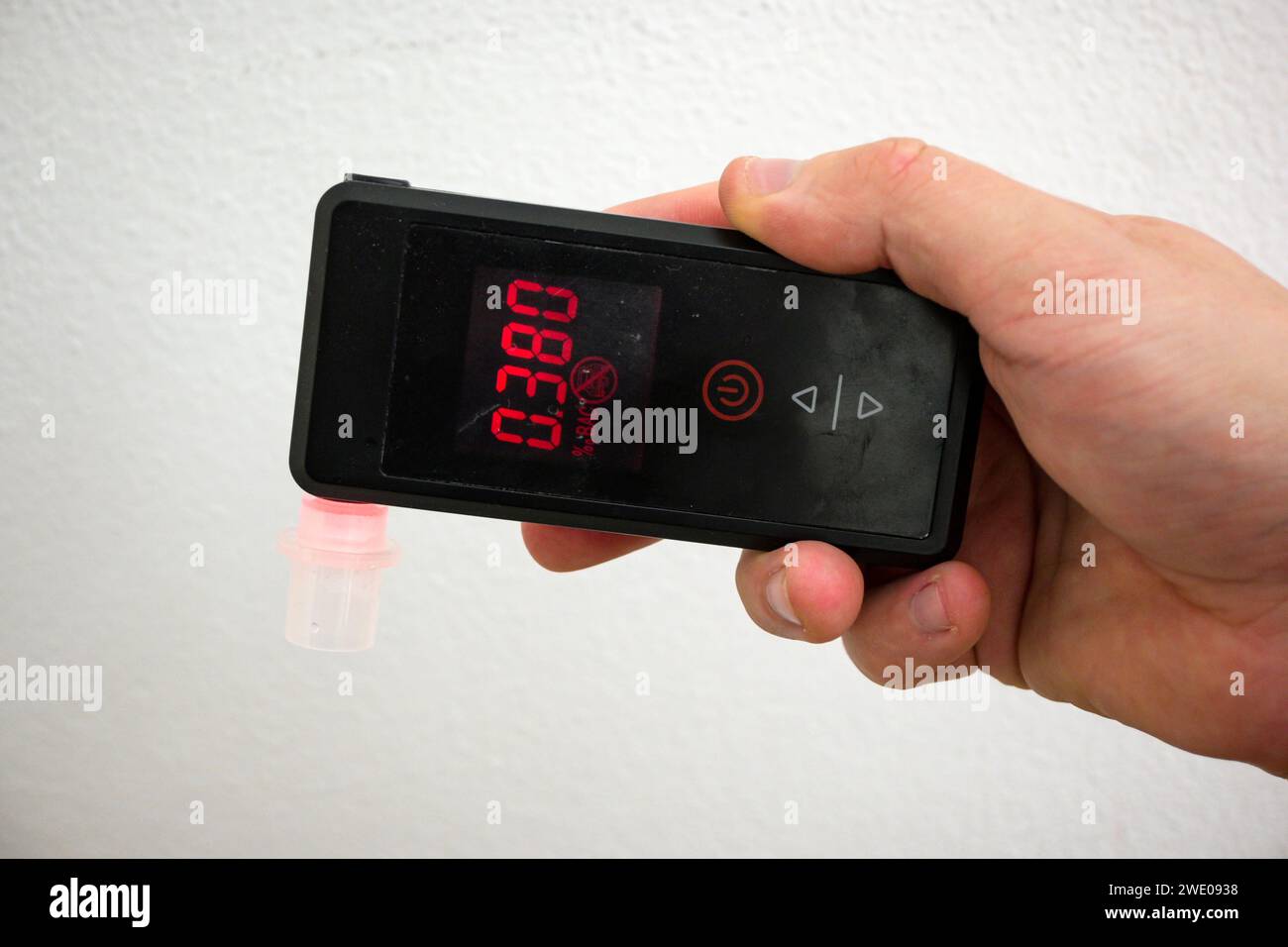 a man takes an alcohol test, white background with a negative result ...