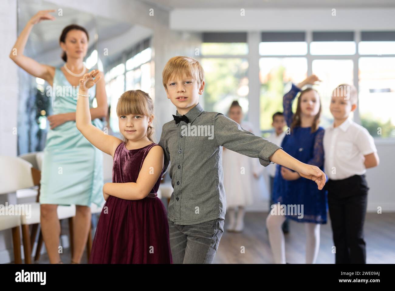 Preteen pupils rehearsing ballroom dance for festive school event Stock ...