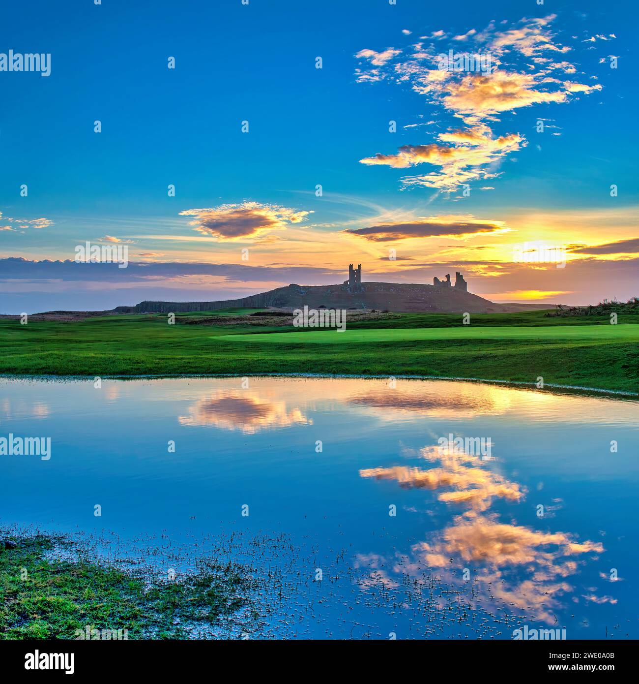 Sunrise at Dunstanburgh Castle in Northumberland looking towards ...