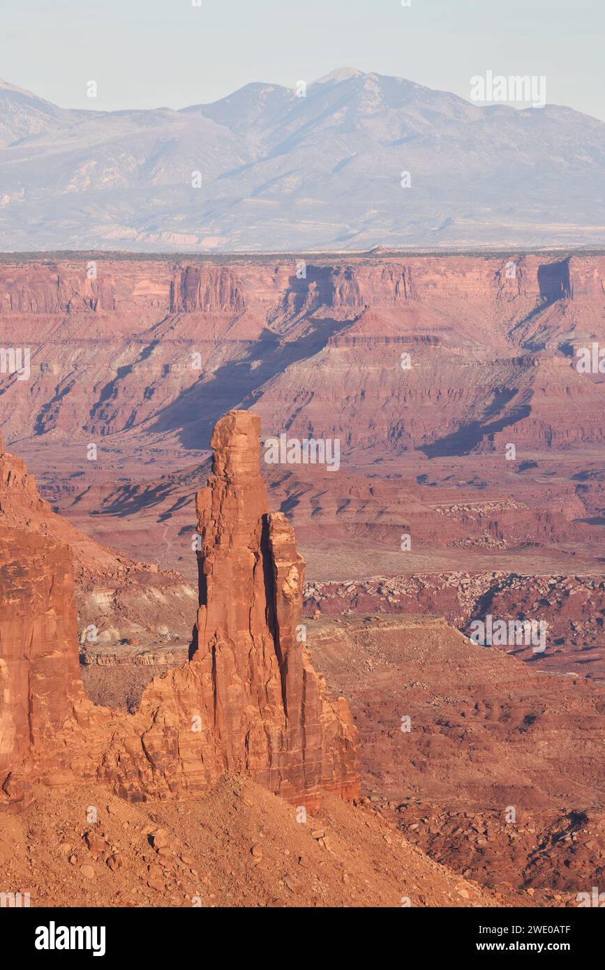 A large rock formation stands out from the surrounding cliffs, seen ...