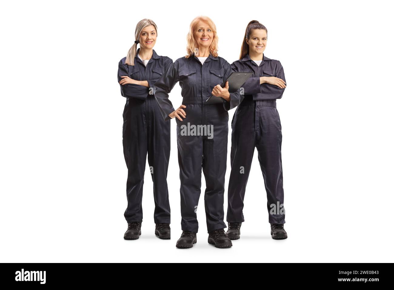Female factory workers in overall uniforms isolated on white background ...