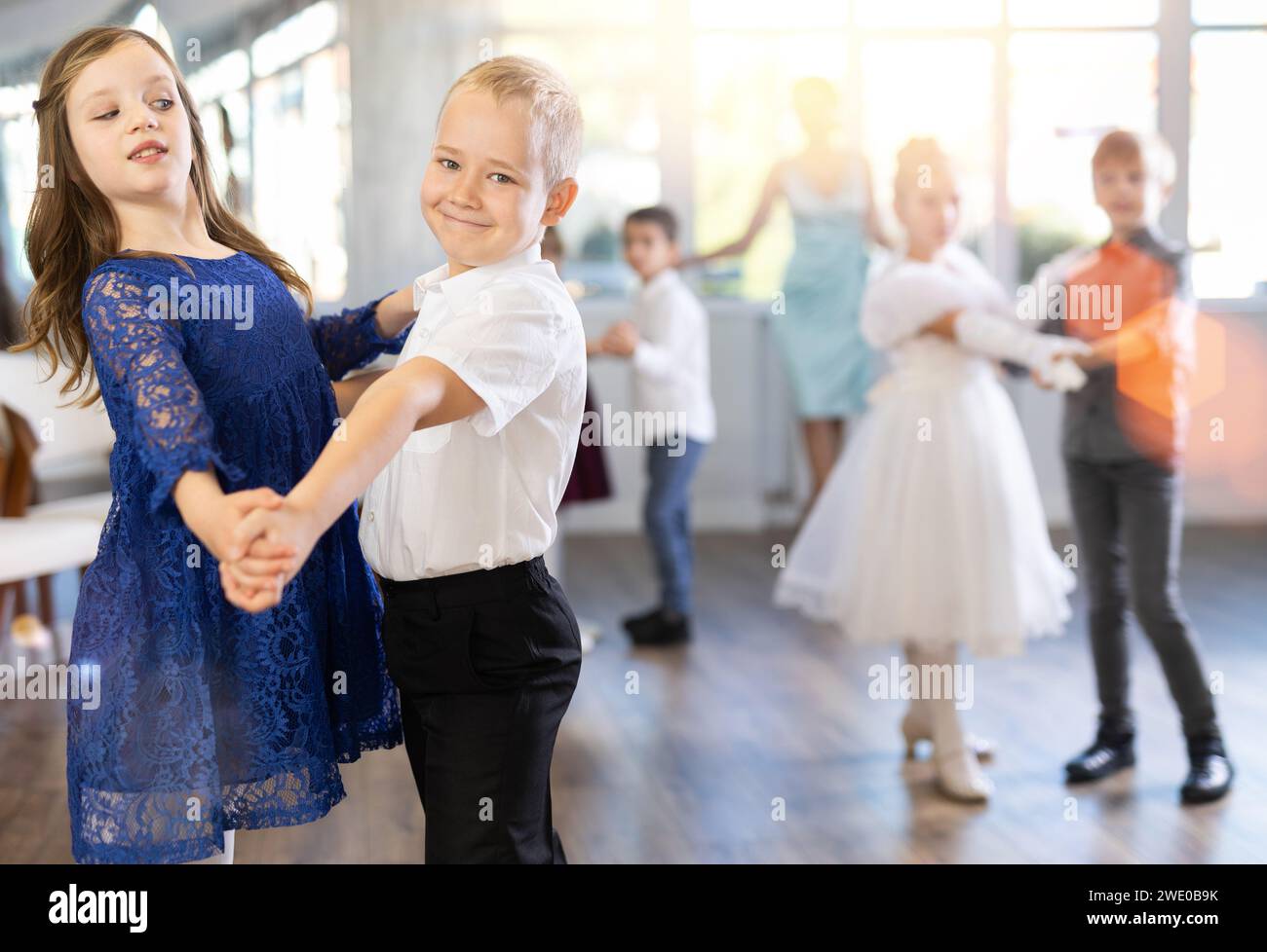 Preteen pupils rehearsing ballroom dance for festive school event Stock ...