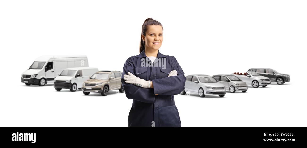 Young female mechanic worker in an overall uniform and gloves posing in ...