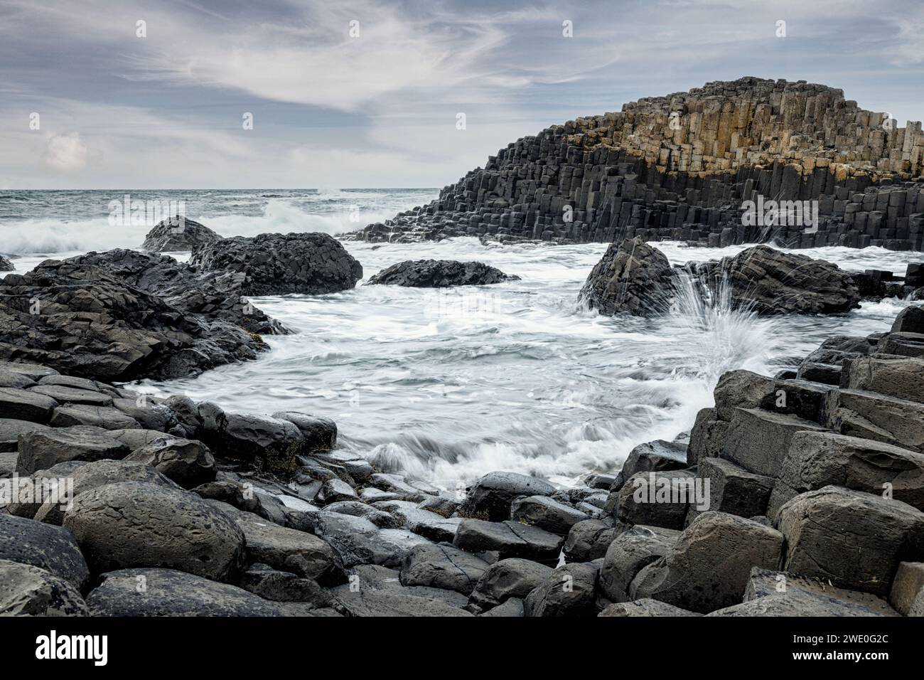 Landscape of the Giant's Causeway with the sea breaking against the ...