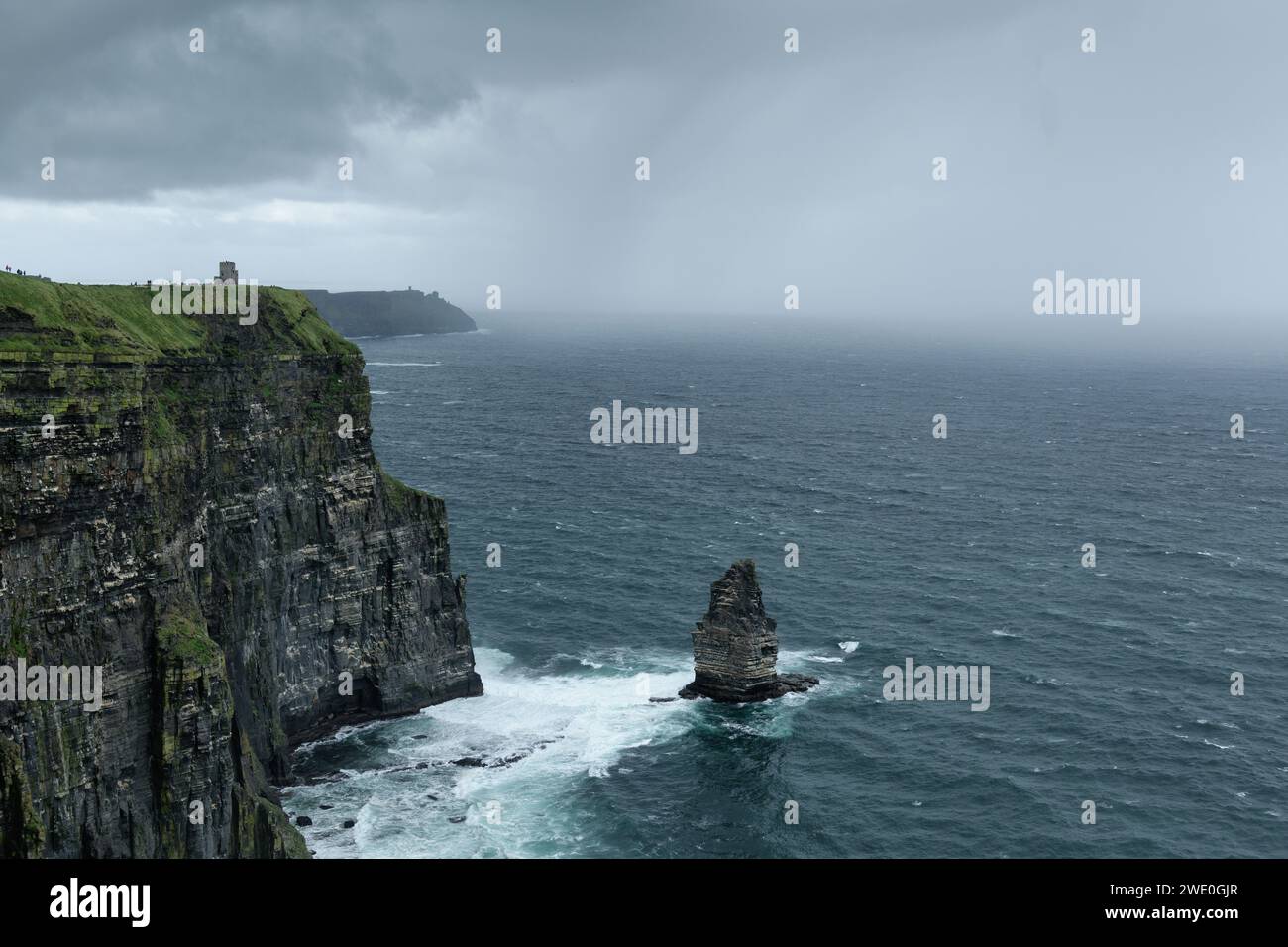 Landscape photograph of the impressive Cliffs of Moher on a windy and ...
