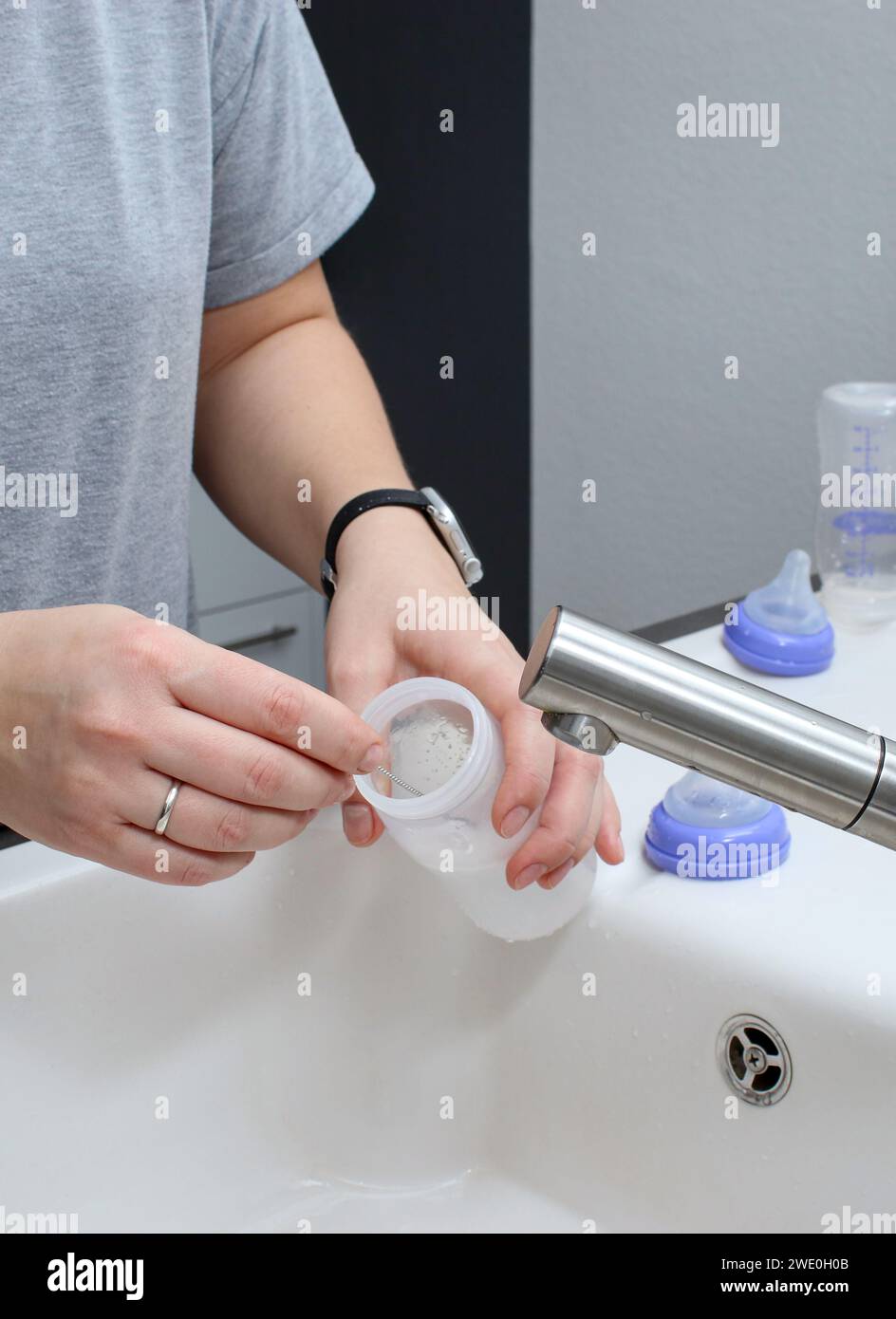 Woman cleaning glass milk bottle hi-res stock photography and images ...