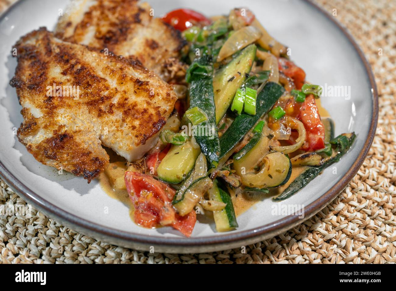 Healthy fish dish of fried redfish fillet with Mediterranean vegetables ...