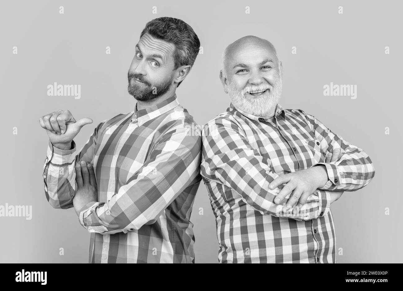 smiling two generation family men on background. photo of two ...