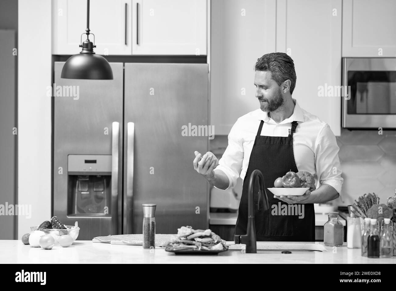 man cooking healthy food in the kitchen with copy space. photo of man ...