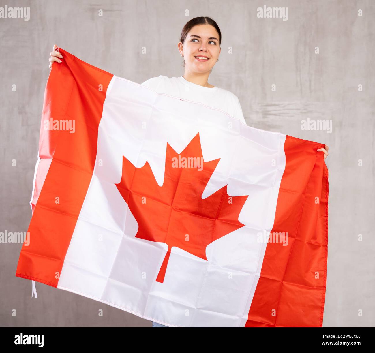 Canadian fan holding national flag hi-res stock photography and images ...