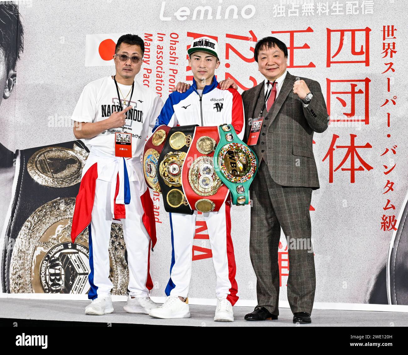 Japan's Naoya Inoue poses with his trainer and father Shingo Inoue (L ...