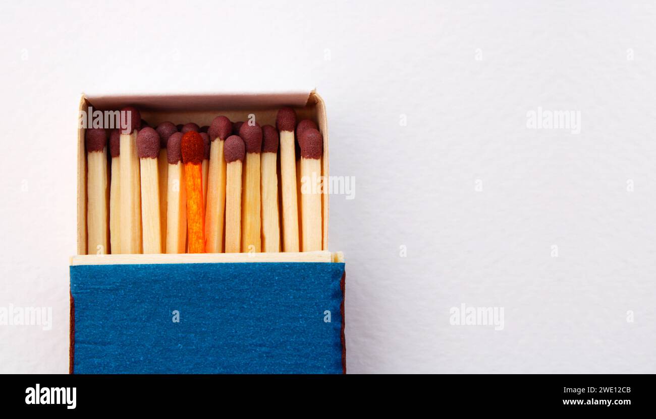 Orange match that differs from the rest inside the box Stock Photo - Alamy