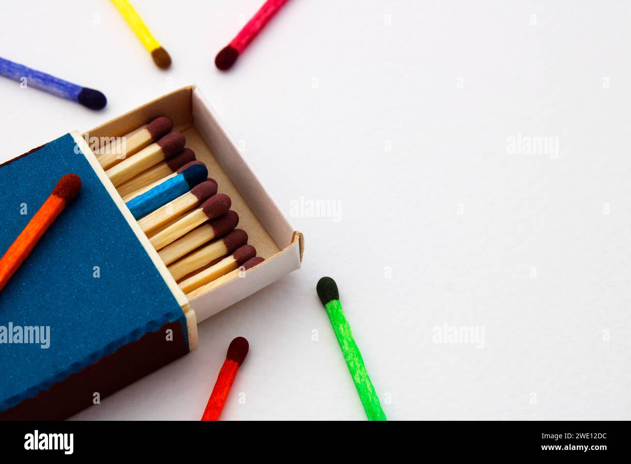 Matches of different colors surrounding a box that contains one inside ...