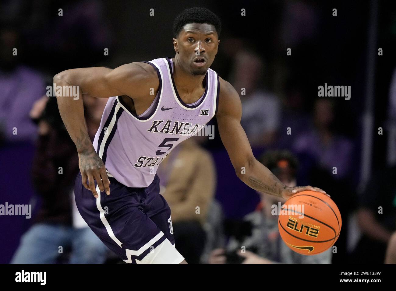 Kansas State guard Cam Carter drives during the second half of an NCAA ...
