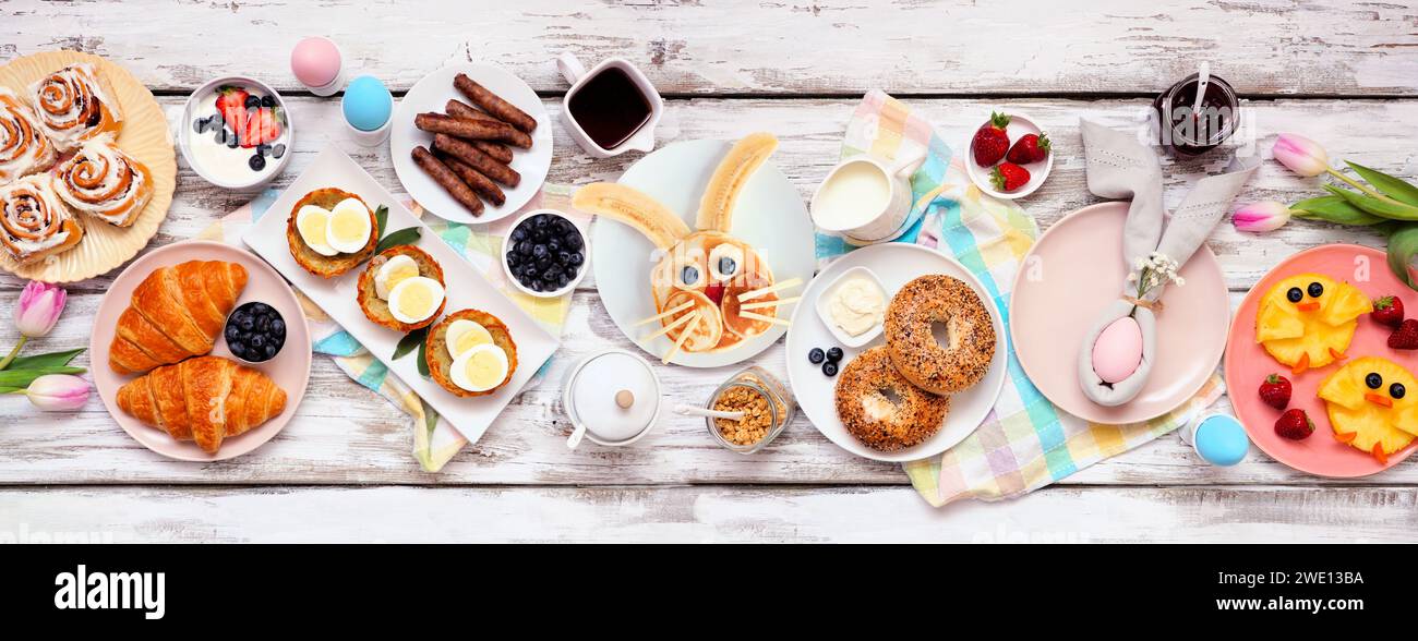 Easter breakfast or brunch table scene. Overhead view on a white wood ...