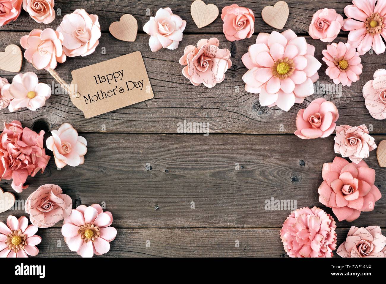 Happy Mothers Day frame with paper flowers and gift tag. Top view ...