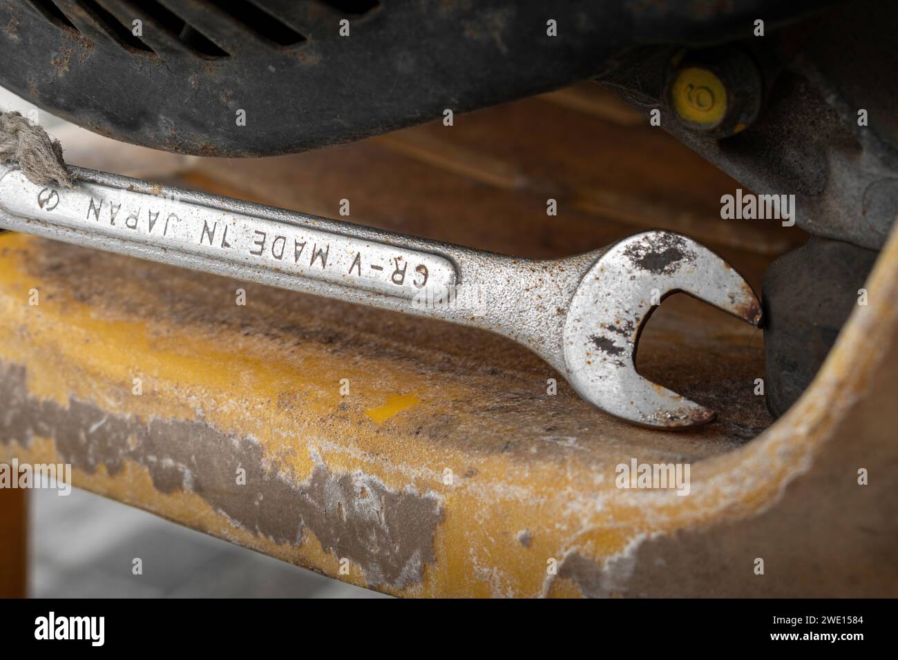 Close up look of an old power generator. Old yellow fuel back up ...