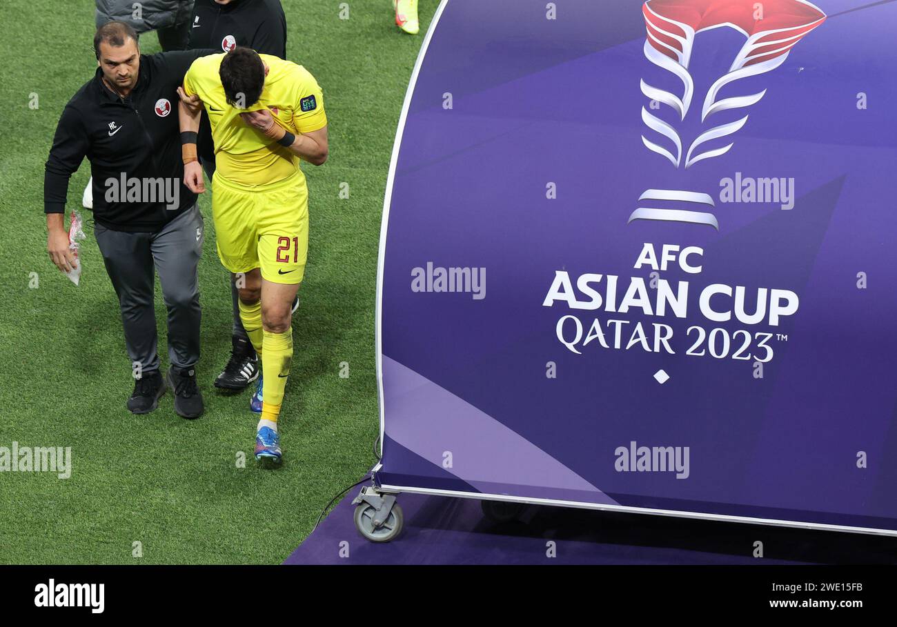 Doha, Qatar. 22nd Jan, 2024. Salah Zakaria (R), goalkeeper of Qatar is ...