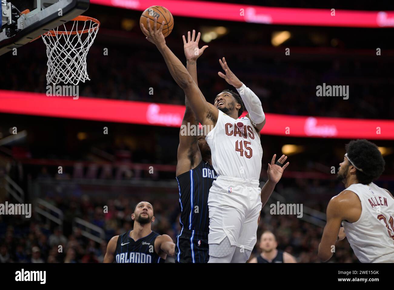 Cleveland Cavaliers guard Donovan Mitchell (45) goes up to shoot as ...