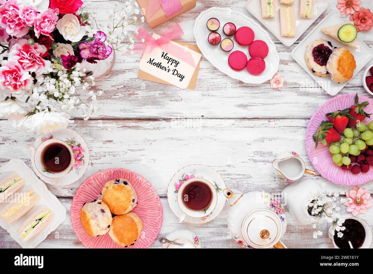 Mother's Day tea frame over a white wood background. Greeting card ...