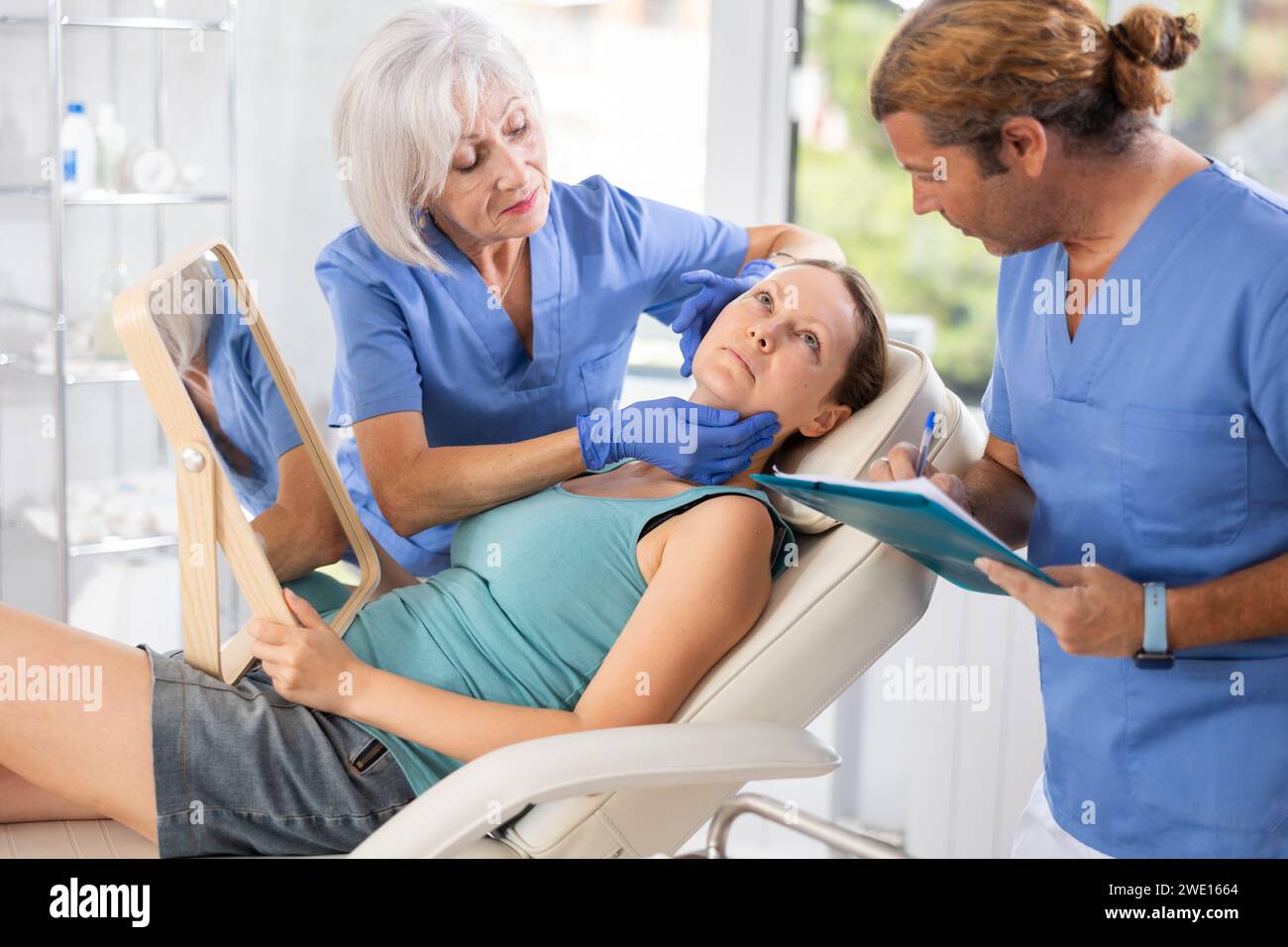 Patient attending to senior hospital hi-res stock photography and ...