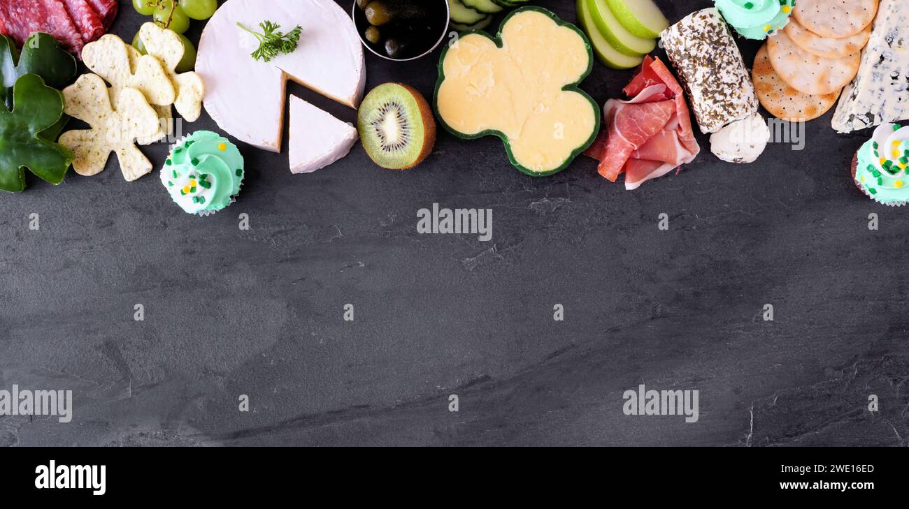 St Patricks Day theme charcuterie top border against a slate background ...