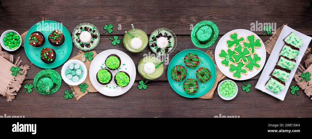 St Patricks Day theme desserts. Table scene over a dark wood banner ...