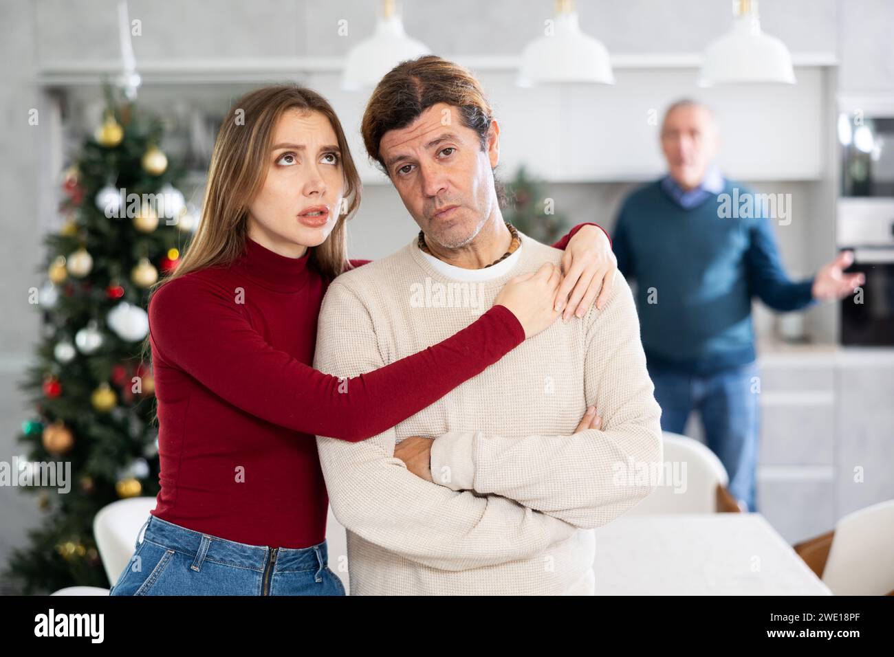Sad couple listens to their elderly father scream and swear while ...